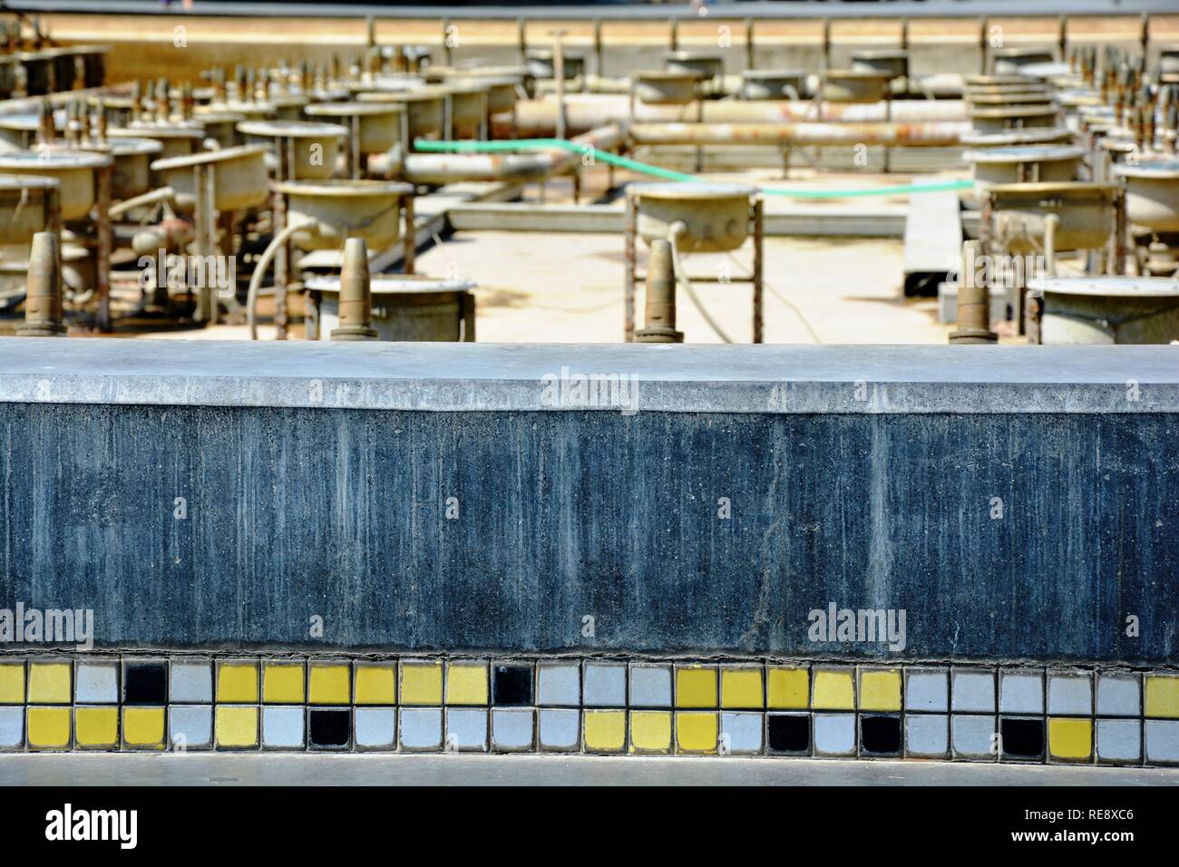 a dry fountain full of pipes and spotlights Stock Photo - Alamy