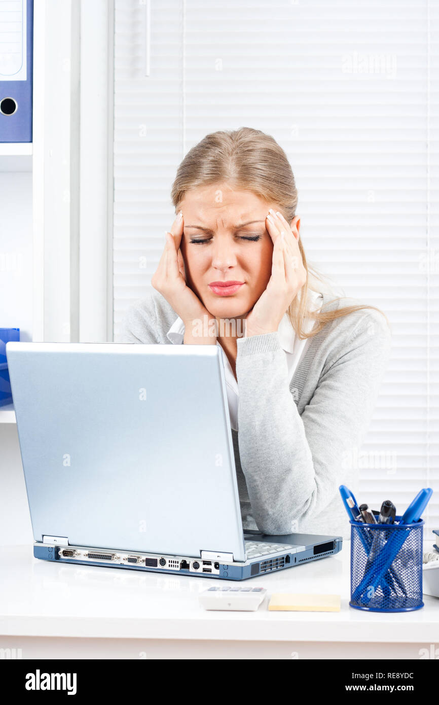 Headache at work Stock Photo - Alamy