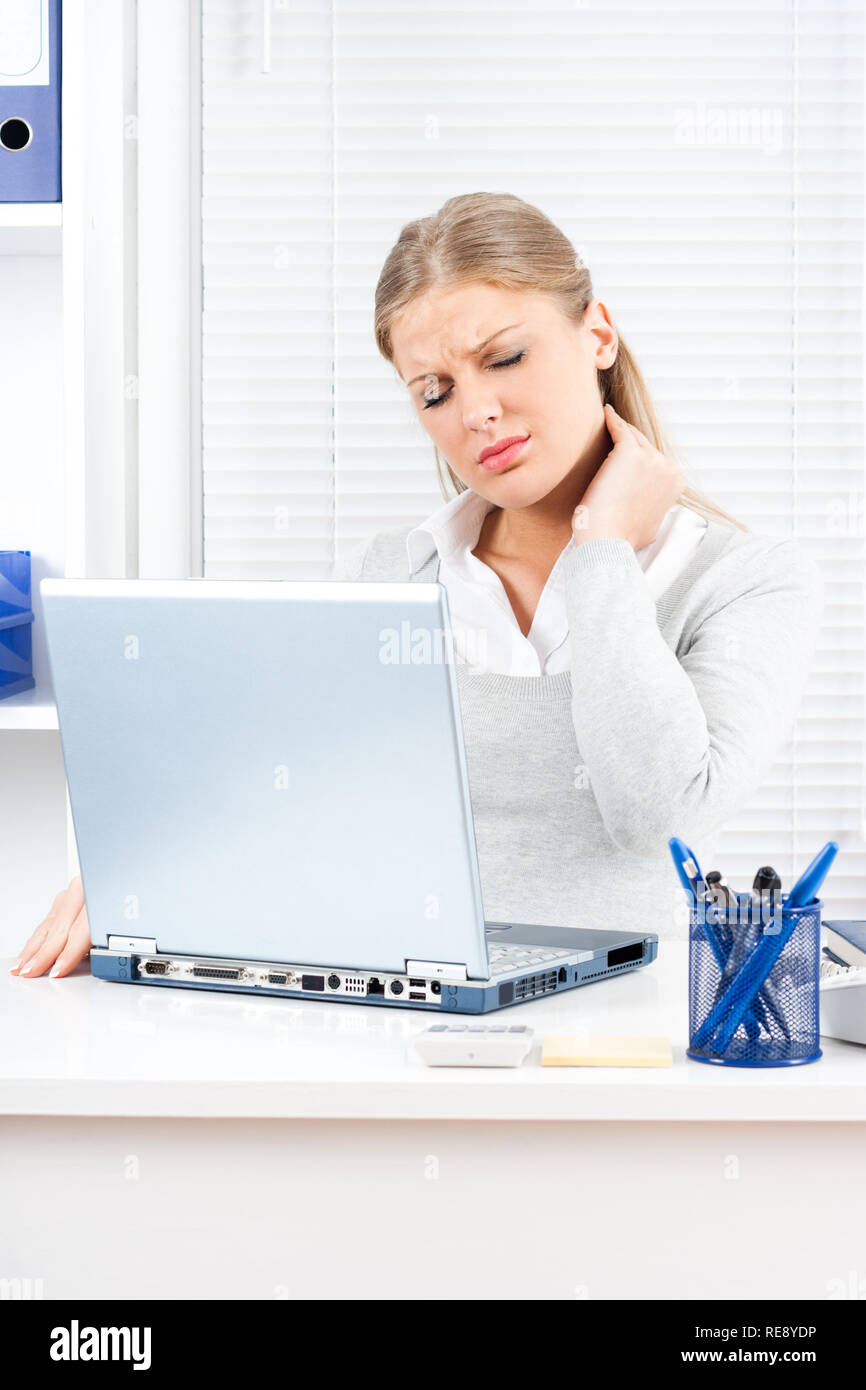 Neck pain at work Stock Photo - Alamy