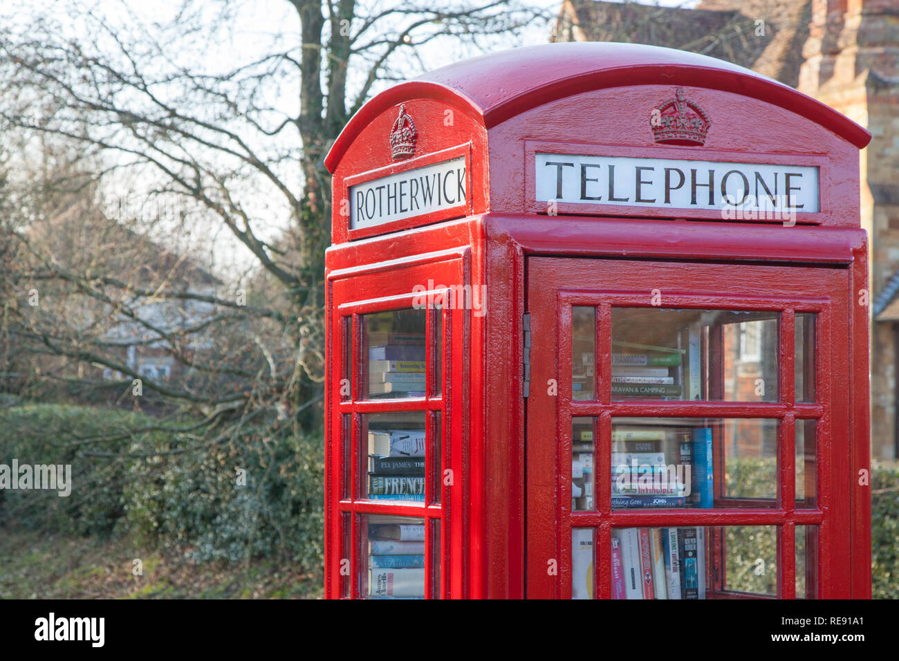 Traditional english red telephone box in a countryside village in ...