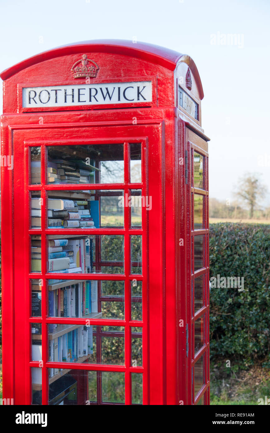 Traditional english red telephone box in a countryside village in ...
