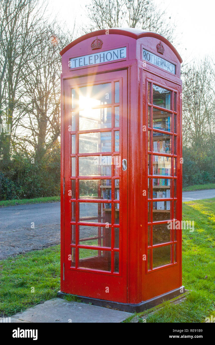 Traditional english red telephone box in a countryside village in ...