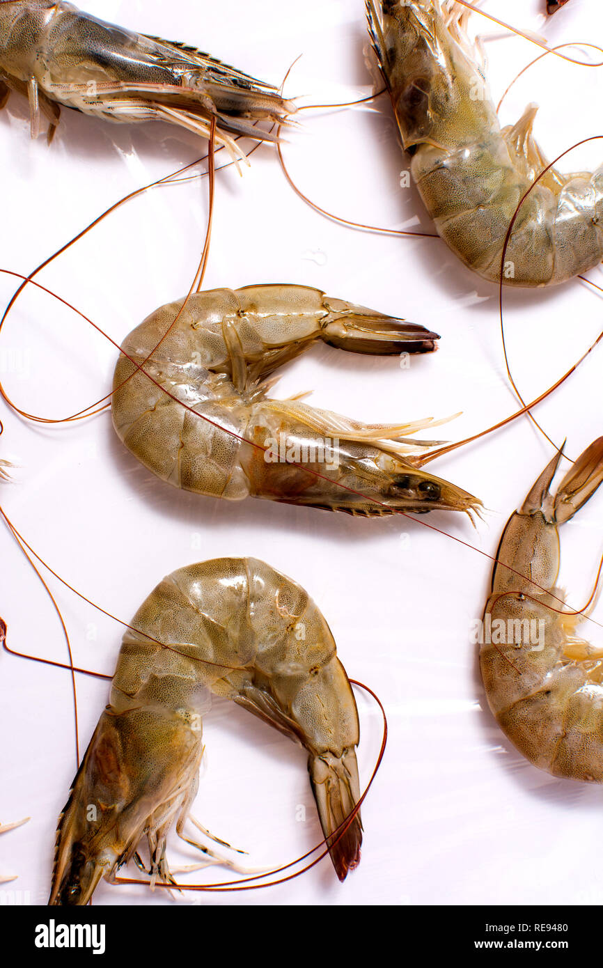 Raw shrimps flat lay top view background Stock Photo - Alamy