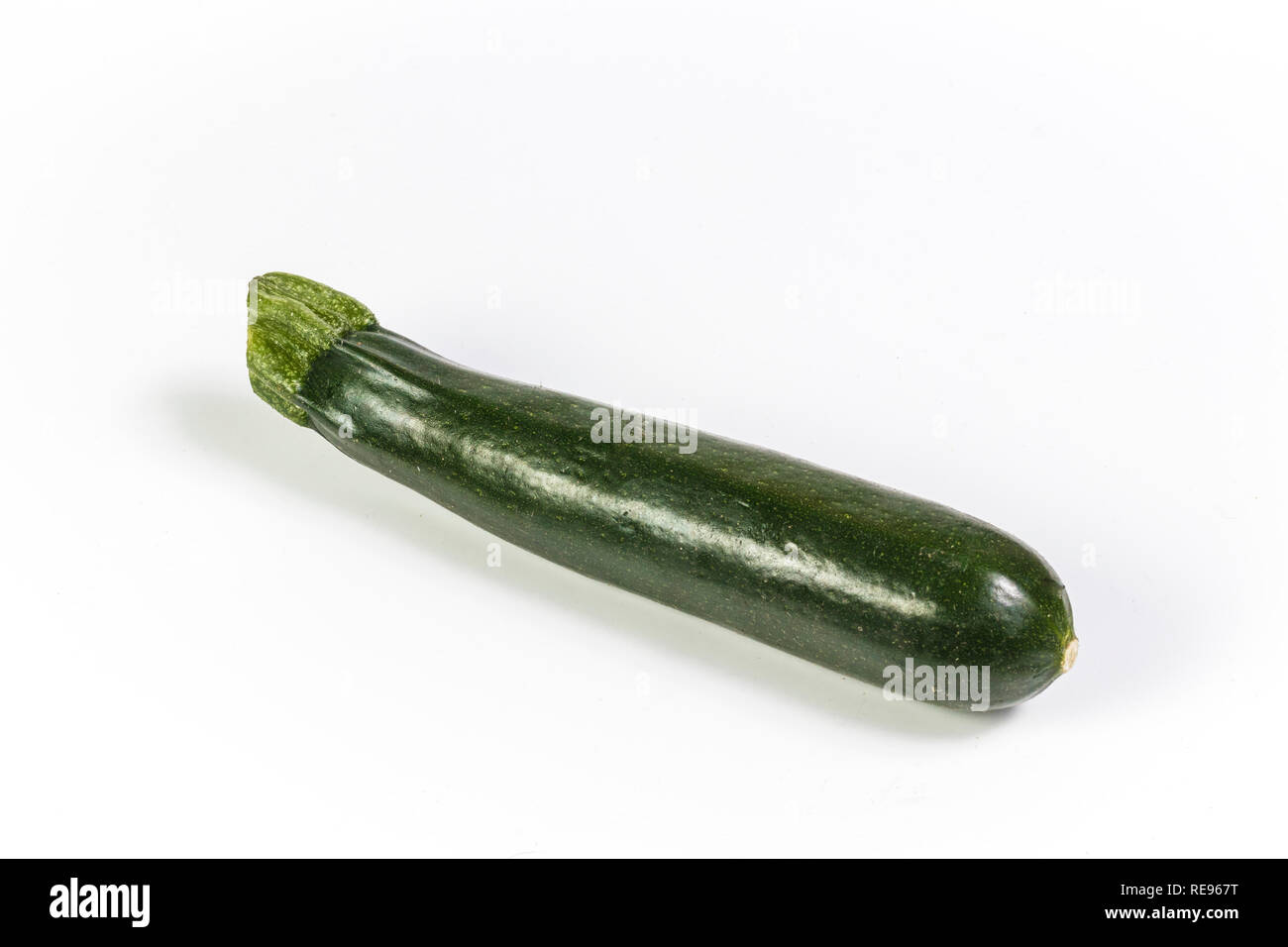 dark green zucchini on white background Stock Photo - Alamy