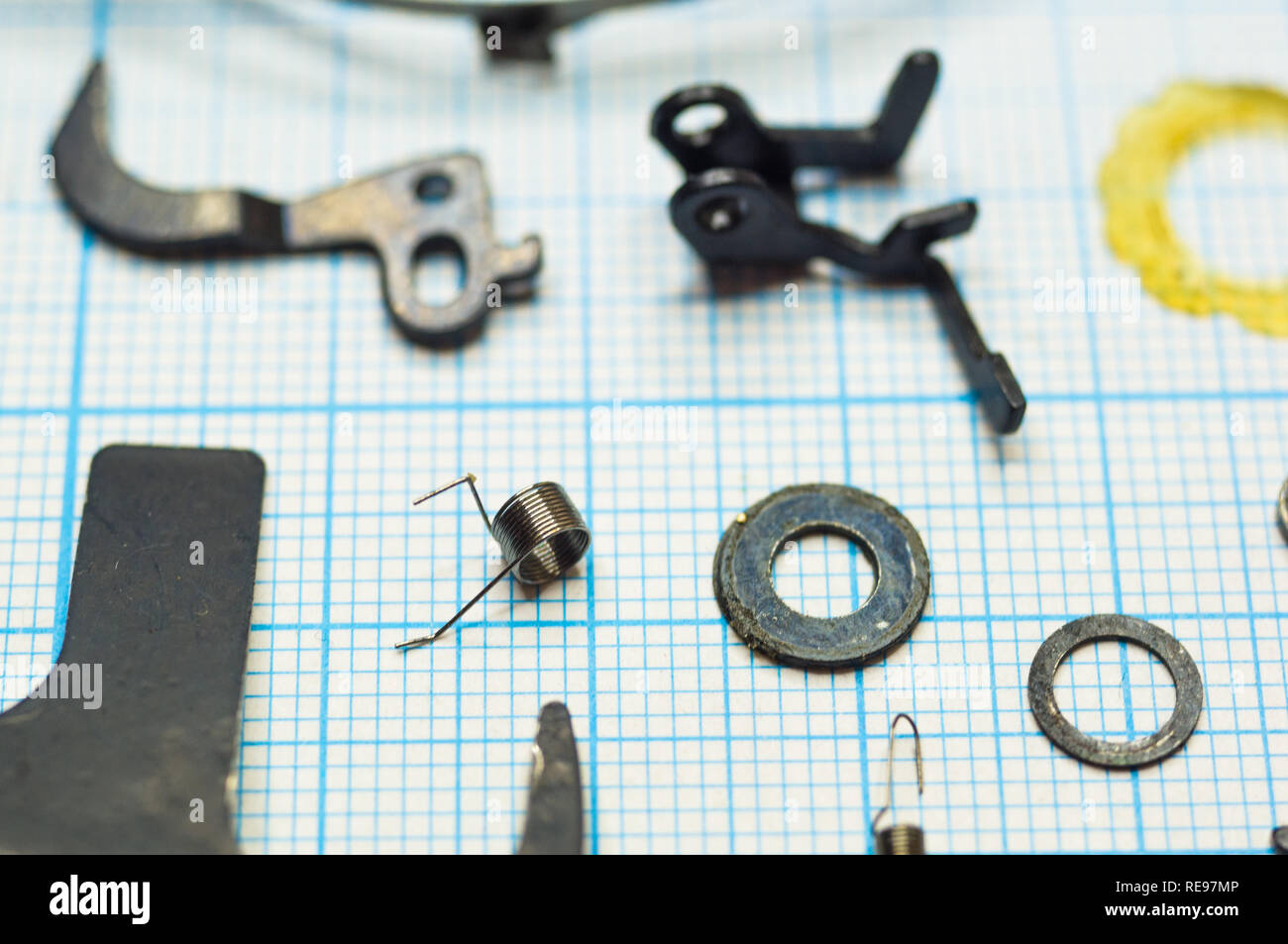 parts are completely disassembled old retro film SLR camera on graph ...