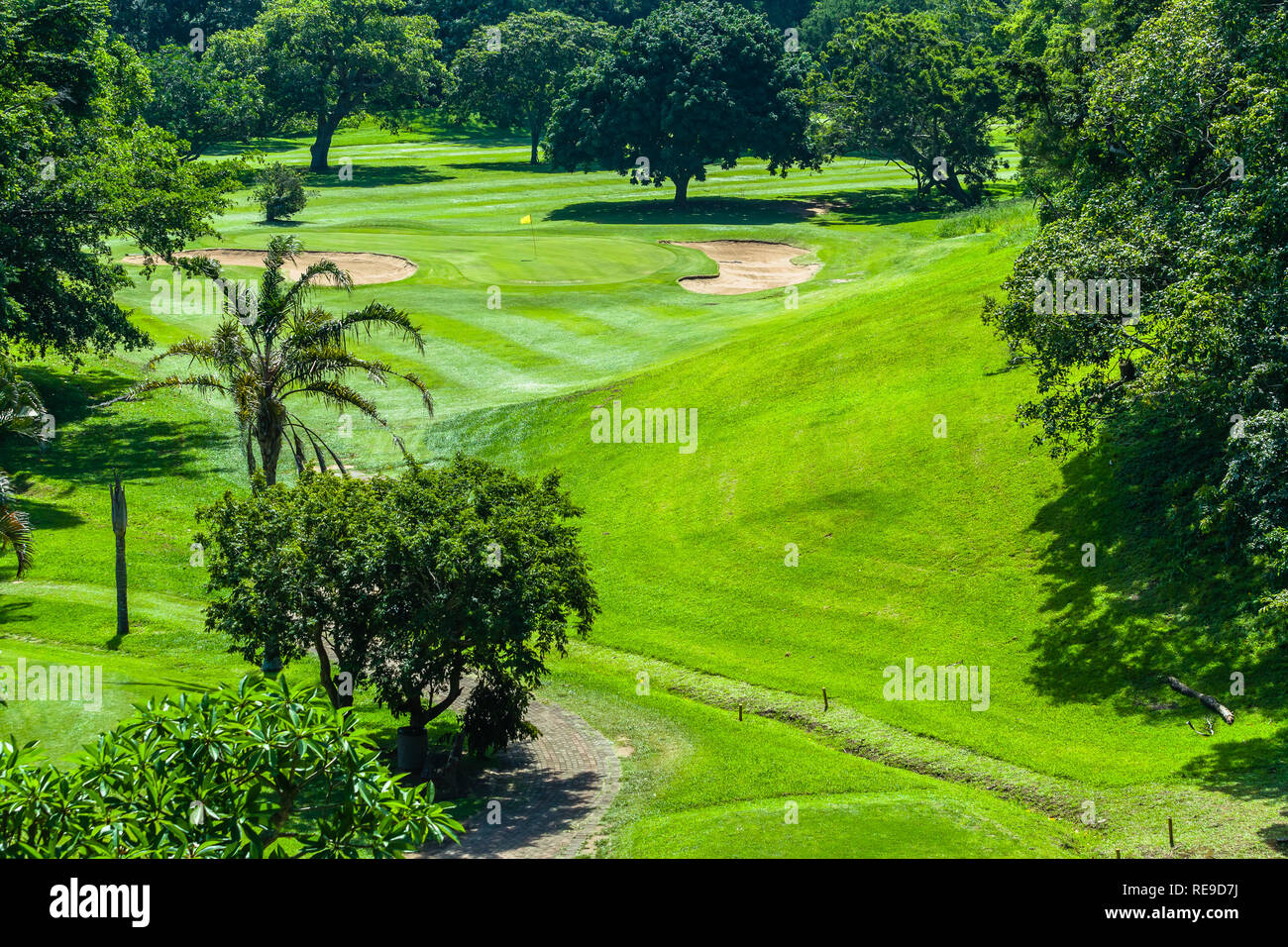 Golf course hole tee-box high elevation down to flagstick green scenic ...