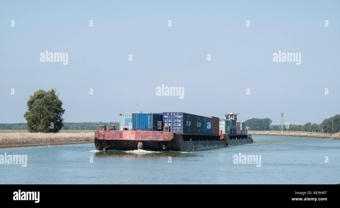 A barge loaded with containers Stock Photo - Alamy
