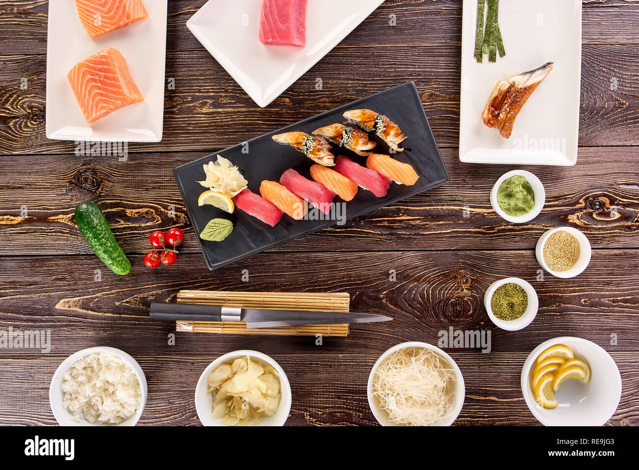 Concept of many plates of sushi and bowls of side dish. Cooking concept ...