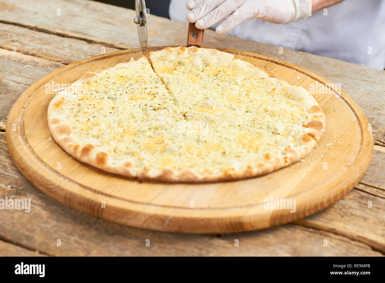 Cheese pizza slice starting to pick up. Pizza slice removing by spatula ...