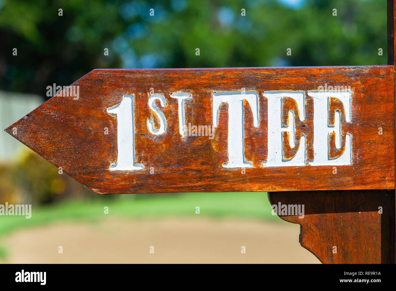 Golf course sign directions to 1 tee box front of last hole green and ...