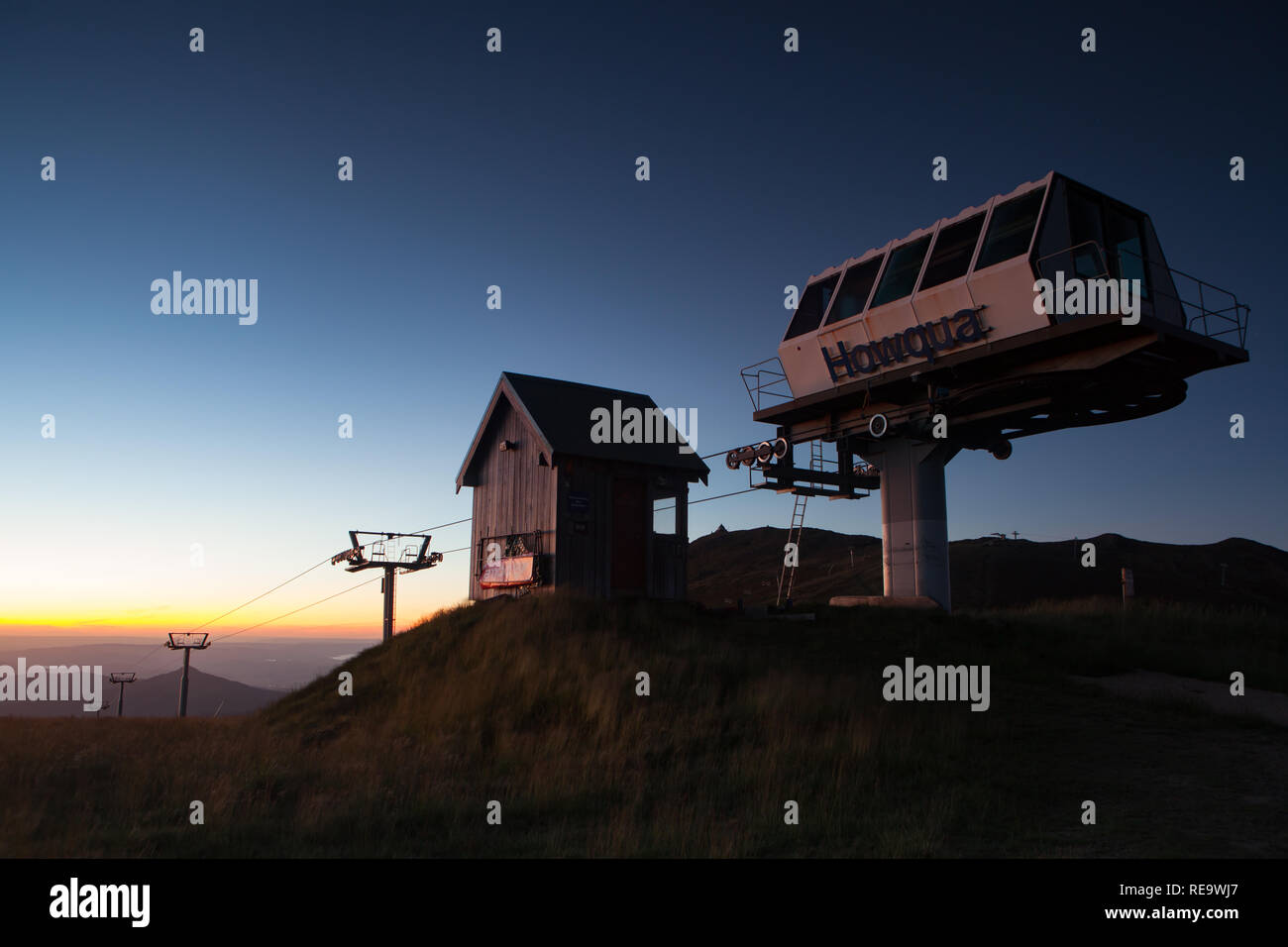 A ski lift and building under a summer starry sky at Mt Buller in the ...