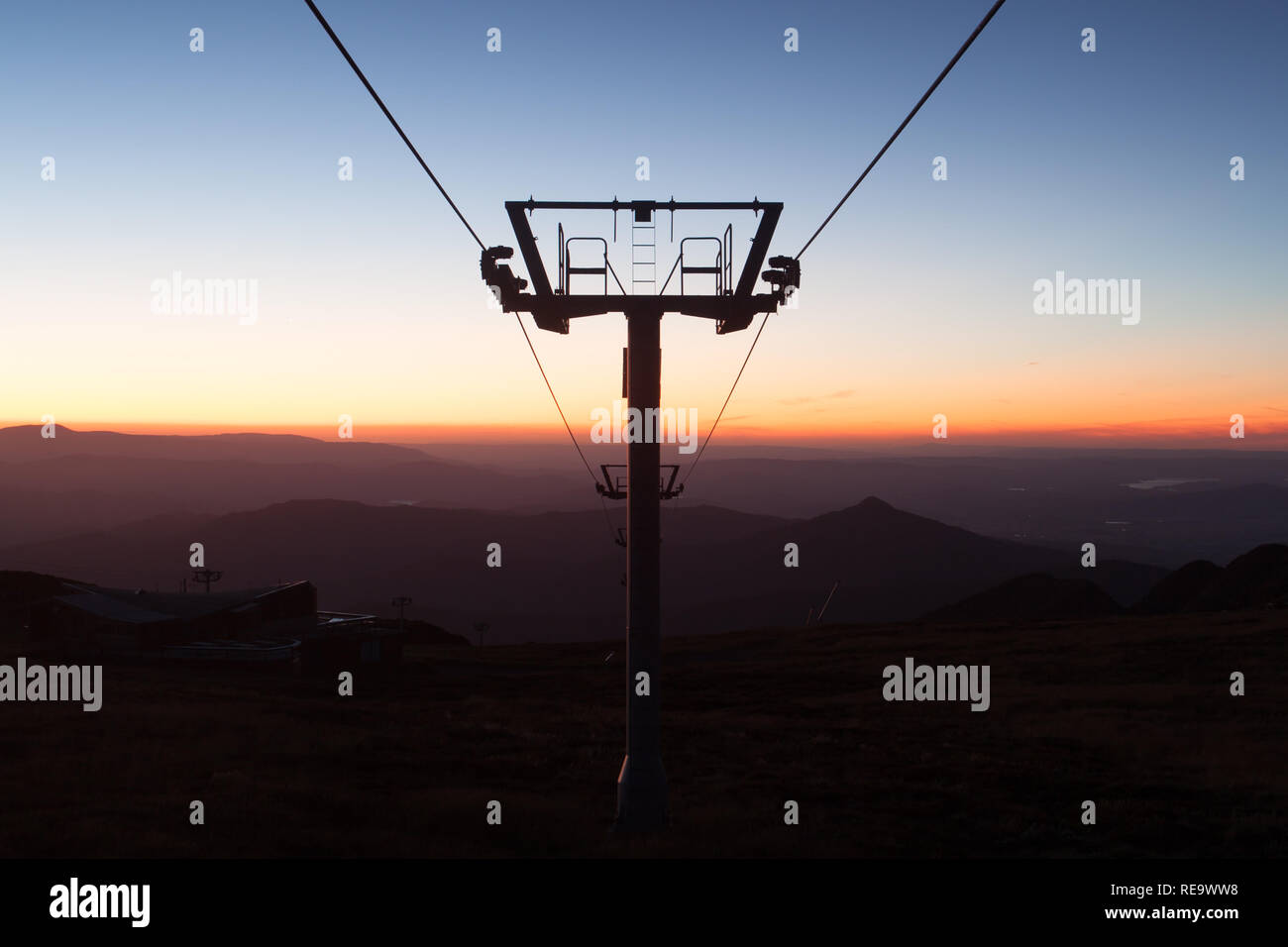 A ski lift and building under a summer starry sky at Mt Buller in the ...