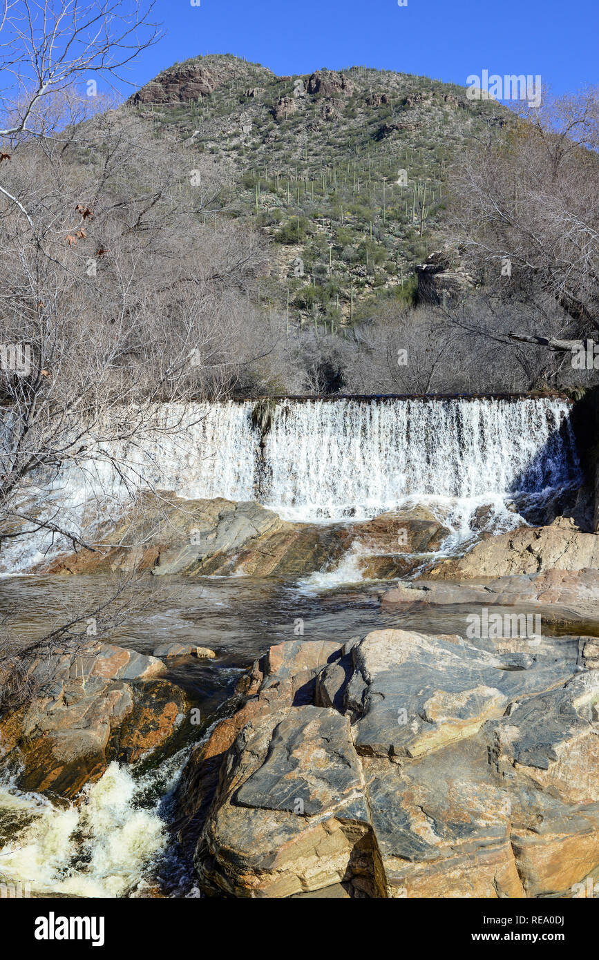 The mountain water runoff flows to the Sabino Canyon Dam in the desert ...