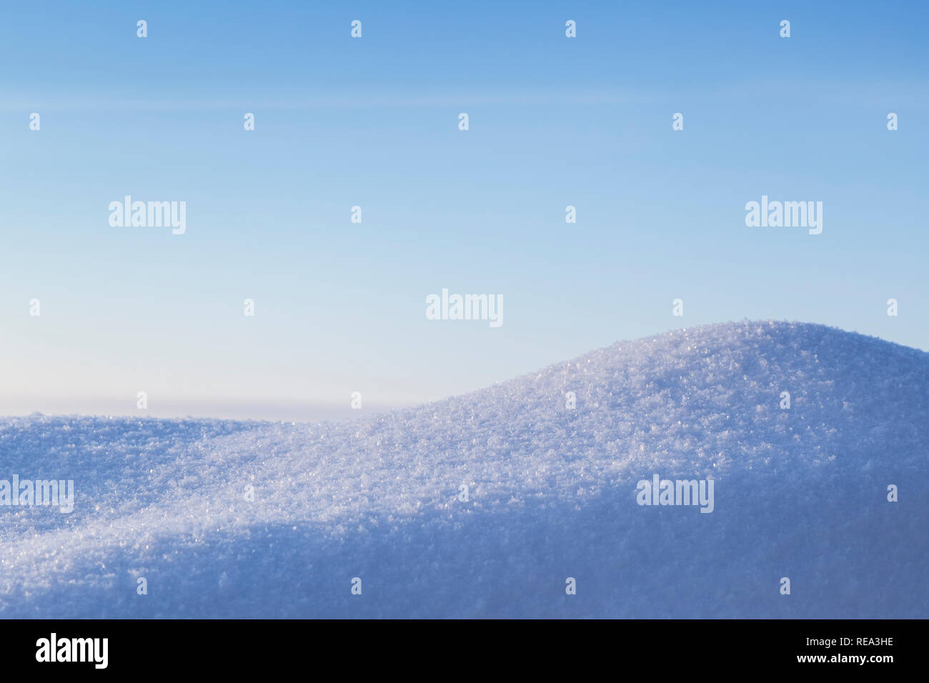 Close-up of fresh shiny snow on a snowdrift on a sunny day in the ...