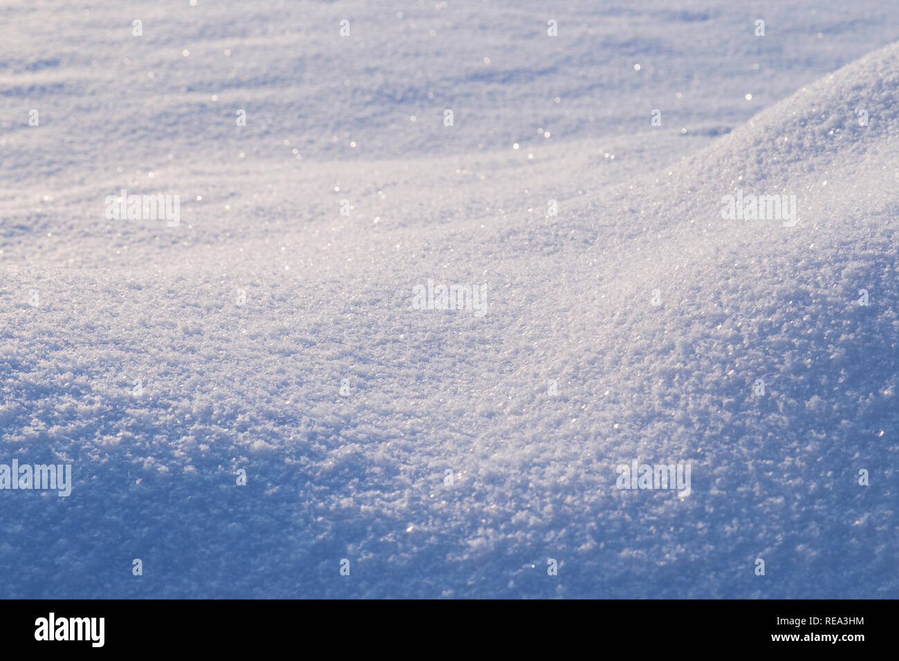 Fresh shiny snow on the ground and snowdrift on a sunny day, good as a ...