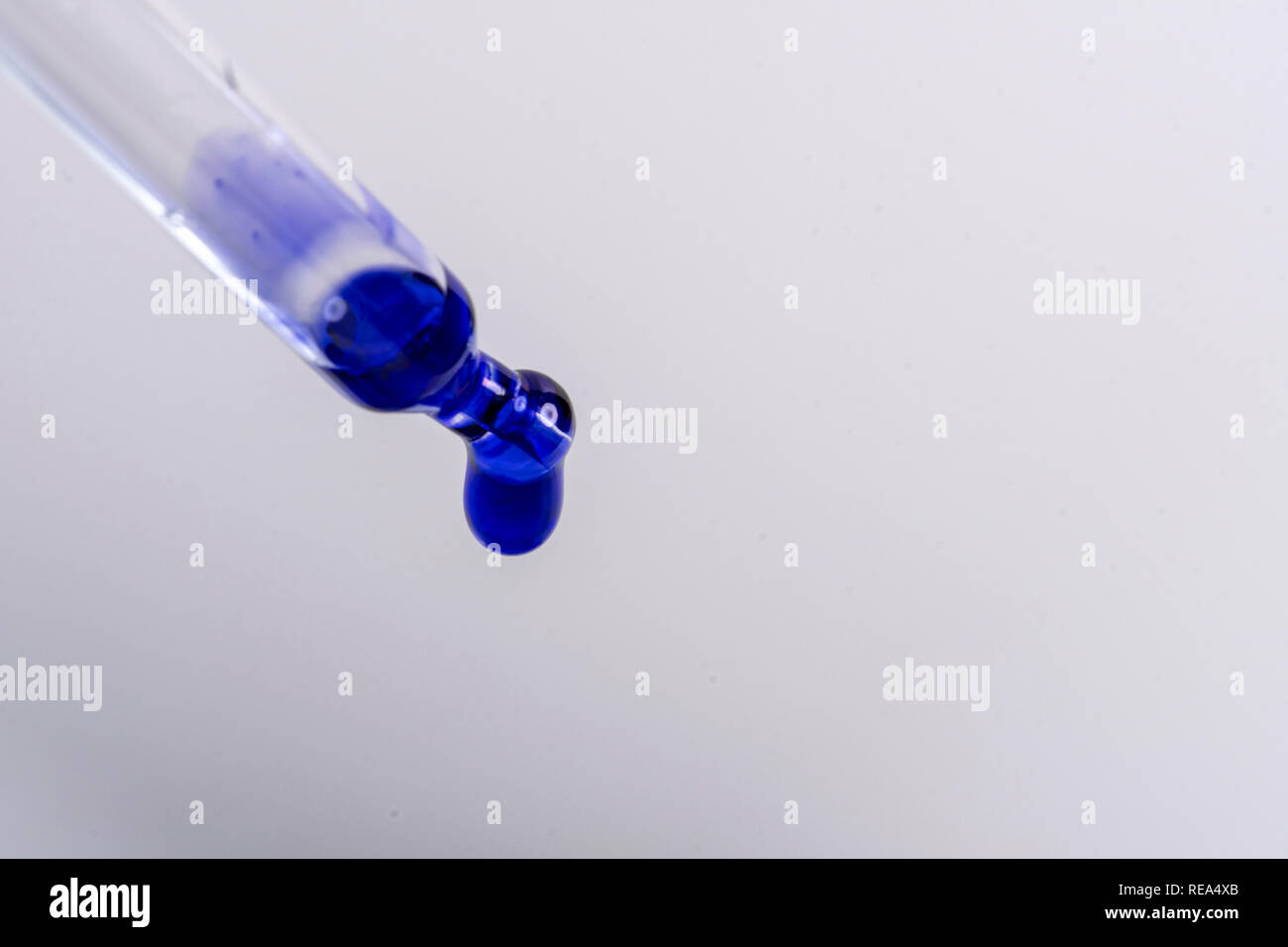 blue ink dripping on a water surface with small waves Stock Photo - Alamy