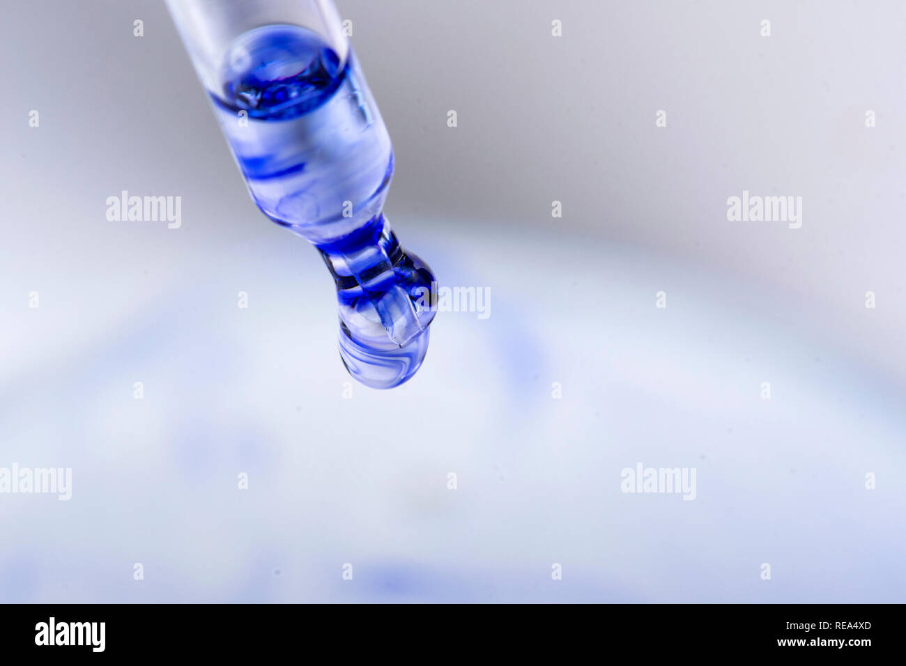 blue ink dripping on a water surface Stock Photo - Alamy