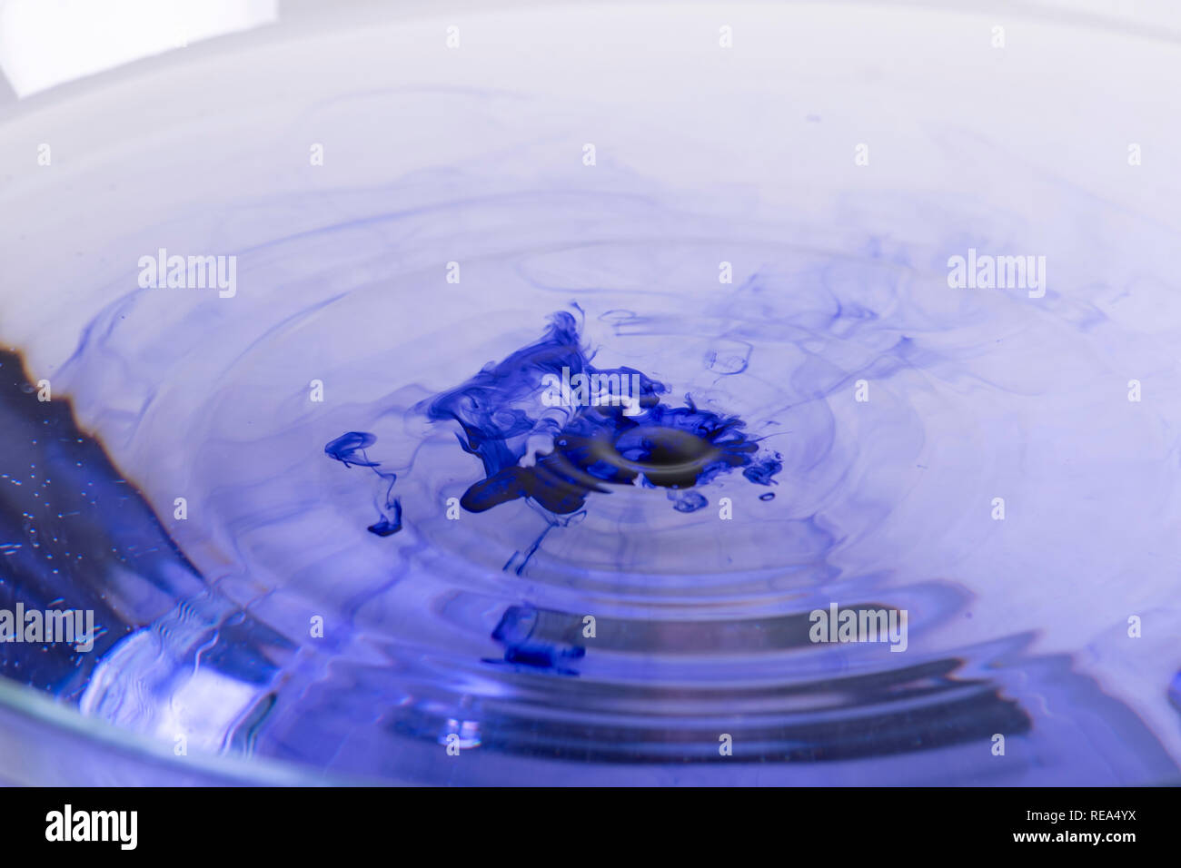 blue ink in water with water drops Stock Photo - Alamy