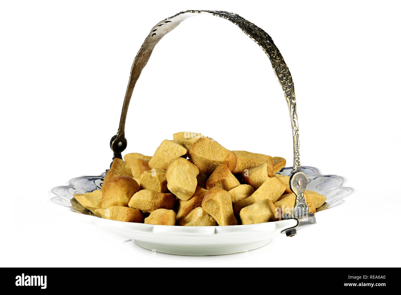 Dutch pepernoten (peppernuts) on a Delftware plate isolated on white ...