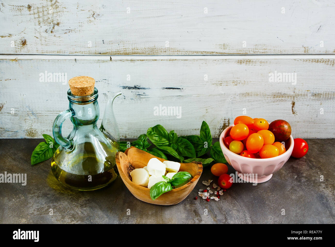 Tomato mozzarella basil leaves and olive oil. Italian salad ...