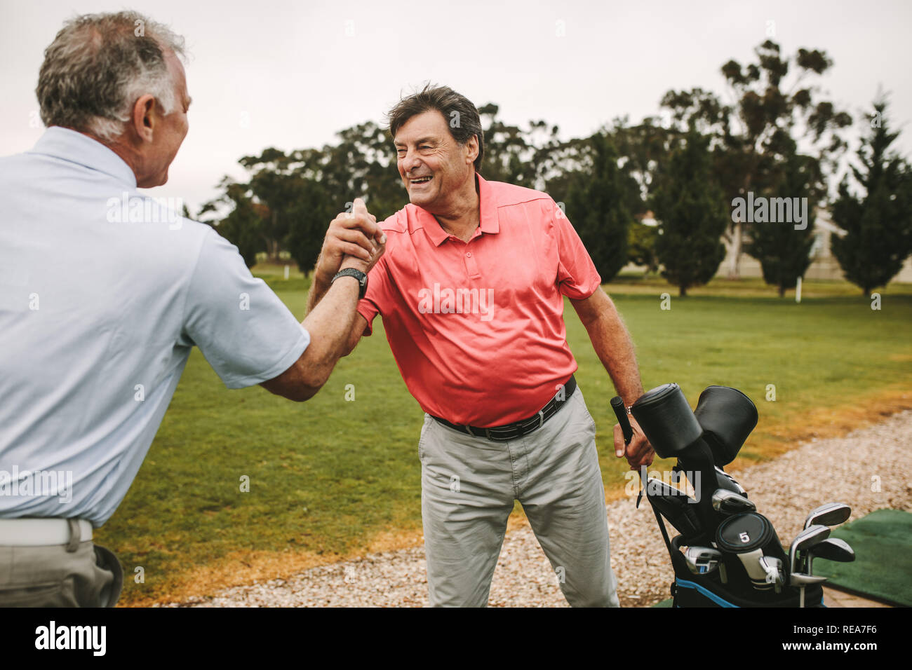 Golf players shaking hands hi-res stock photography and images - Alamy