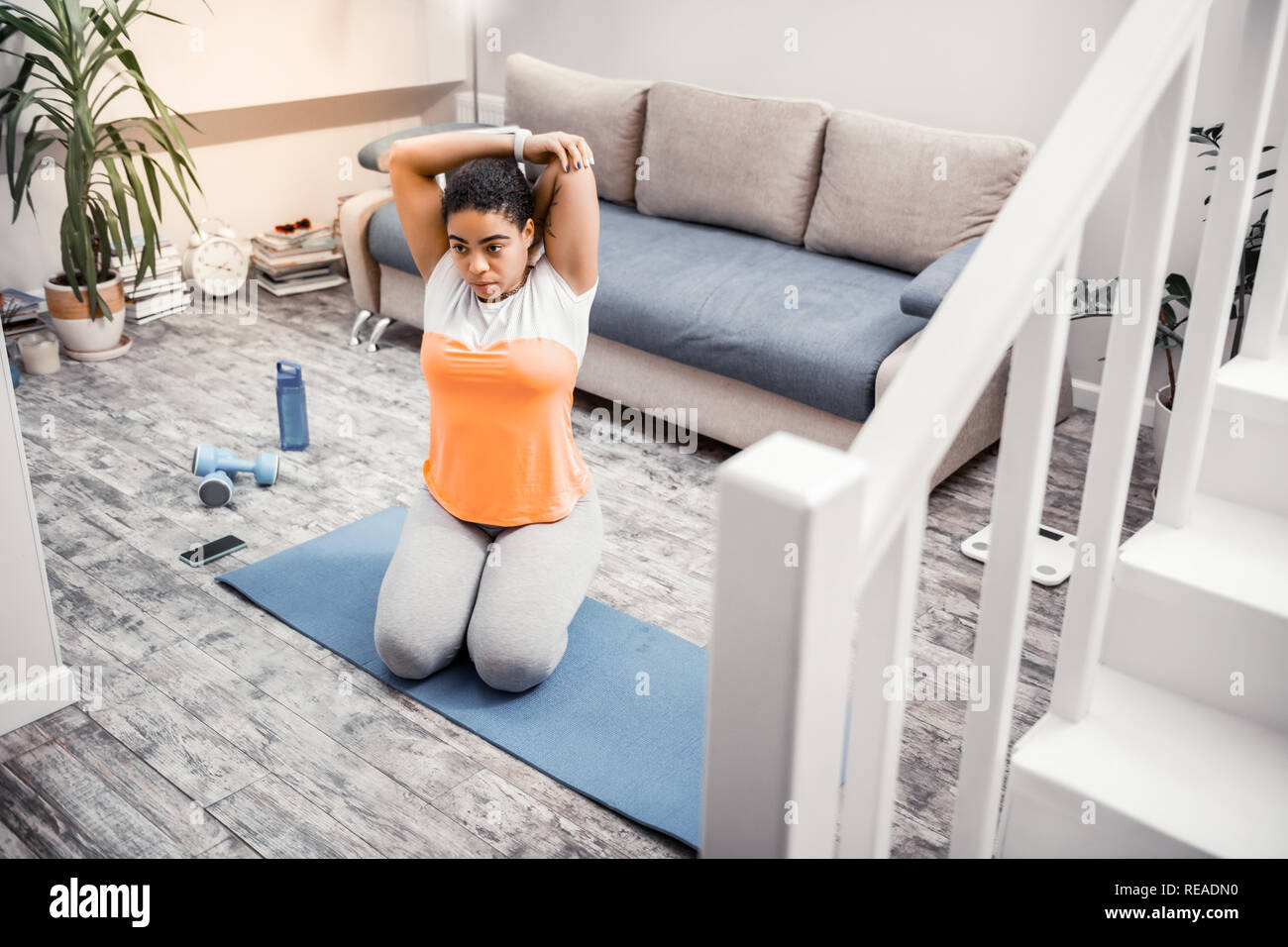Good-looking well-minded active lady rising her hands Stock Photo - Alamy