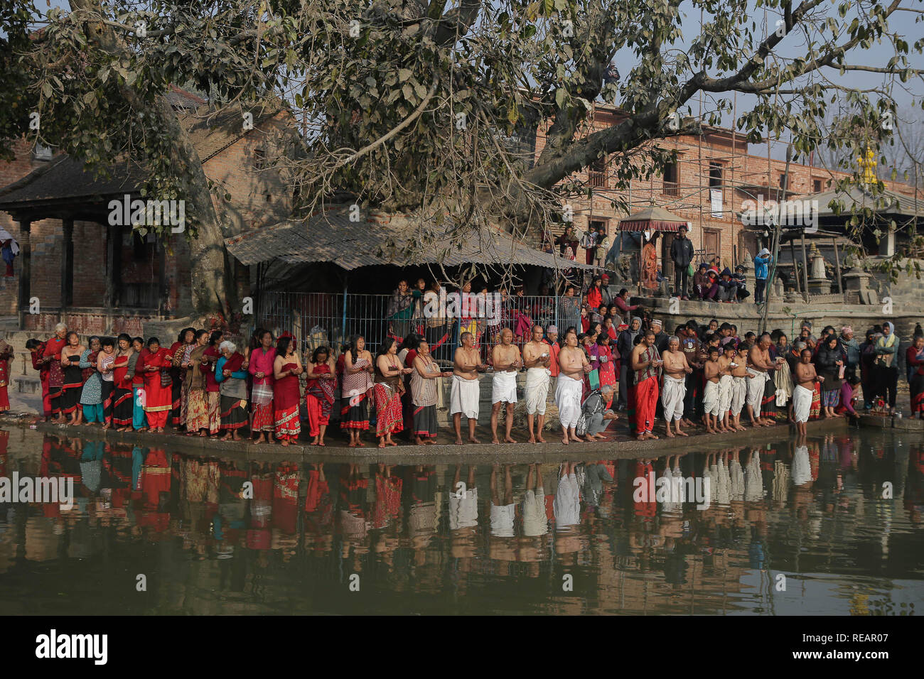 Devotees offer prayers at the bank of the Hanumante River during the ...