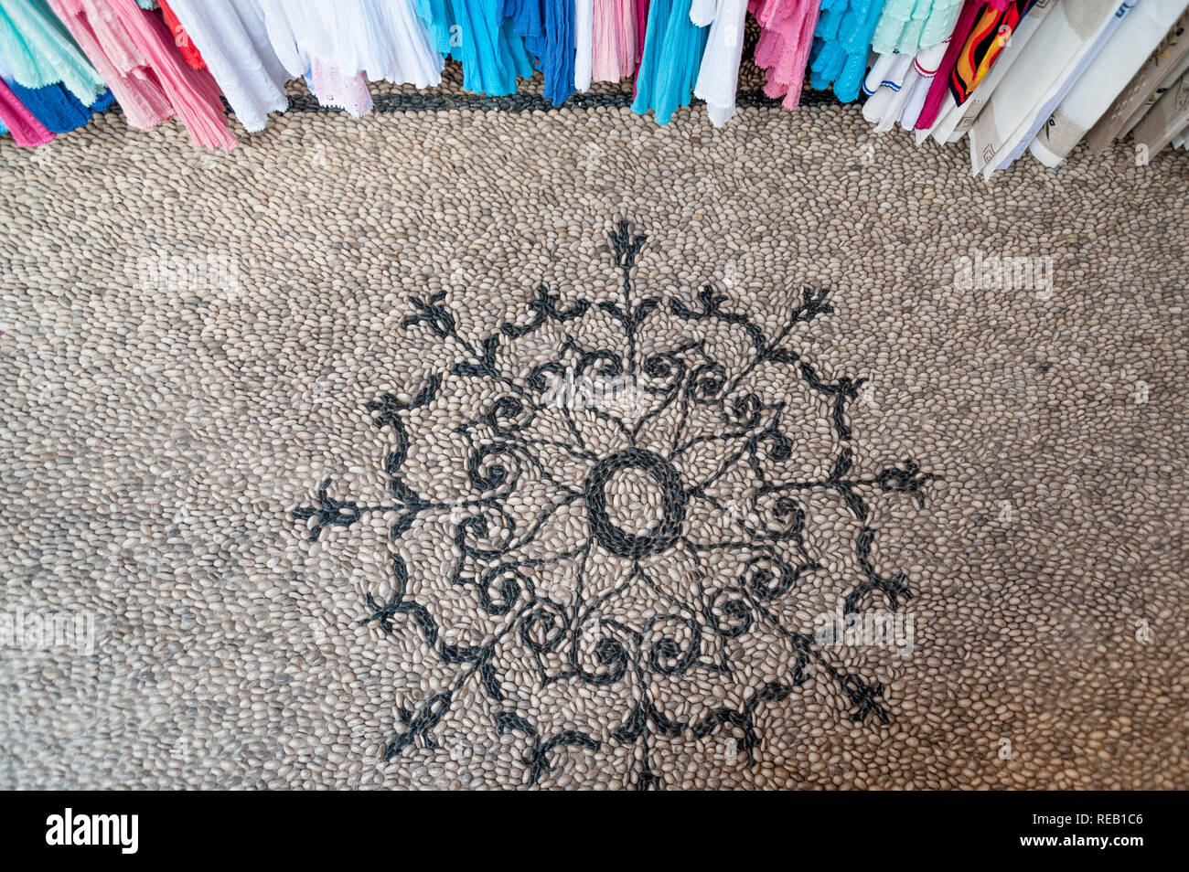 Pebble stone mosaic. Rosetta floral motif. Pavement. Lindos Town. Greek ...