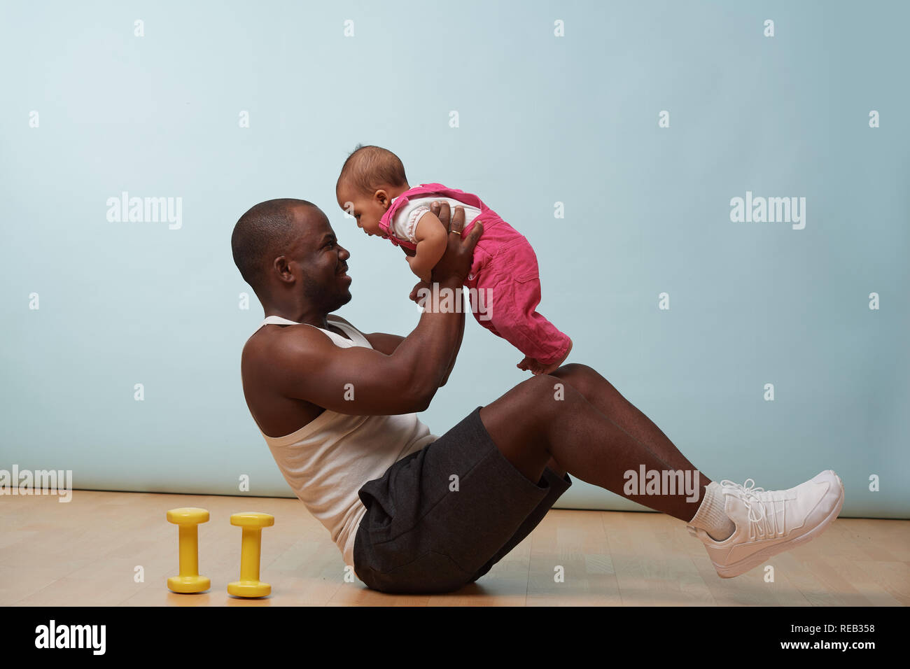Black Baby Lifting Weights