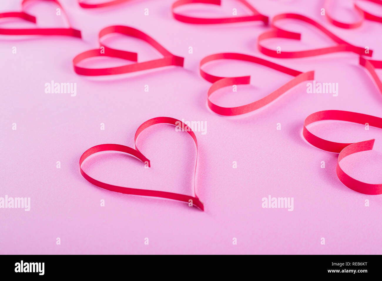 red heart shape on ping background Stock Photo - Alamy