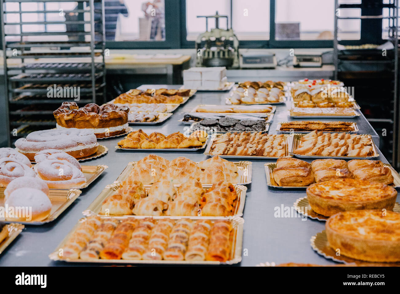 many different dishes prepared on the metal table of a food factory ...