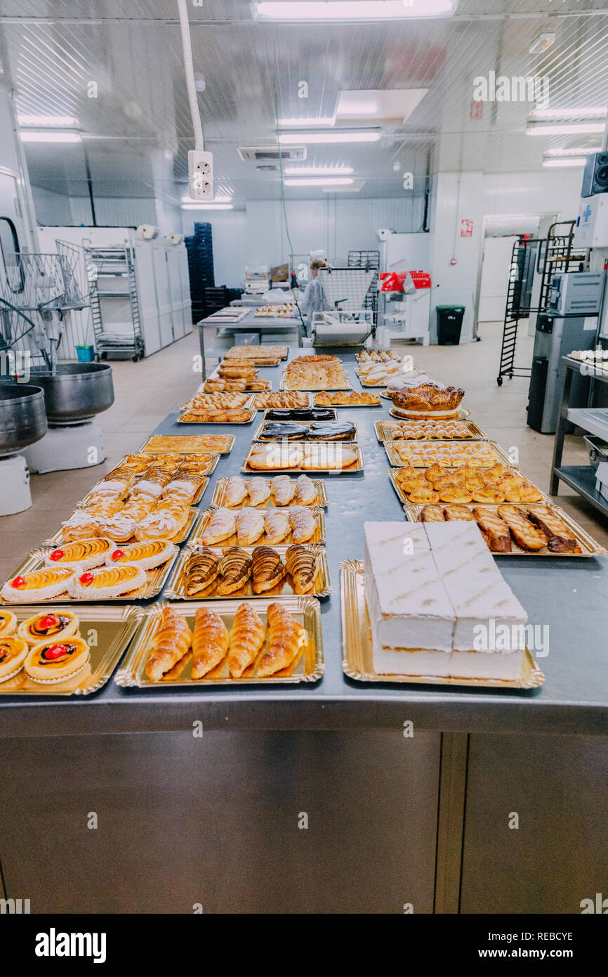 many different dishes prepared on the metal table of a food factory ...