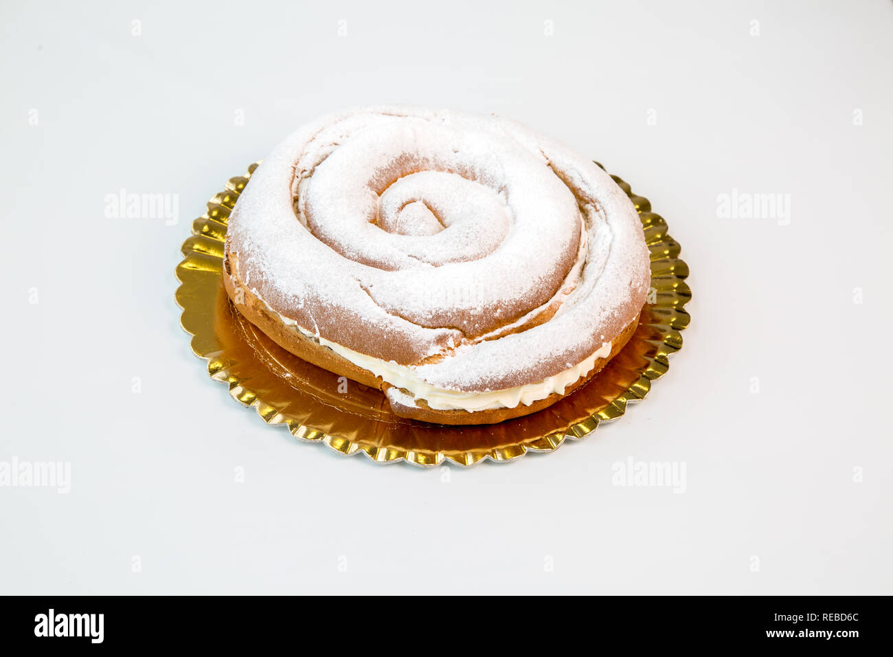 sweet pastries in a gold tray on white background Stock Photo - Alamy
