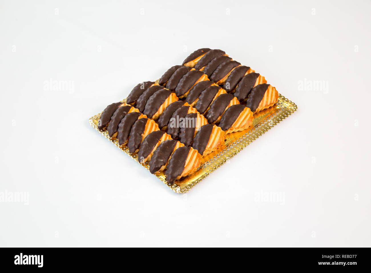 cookies on a gold tray with white background Stock Photo - Alamy