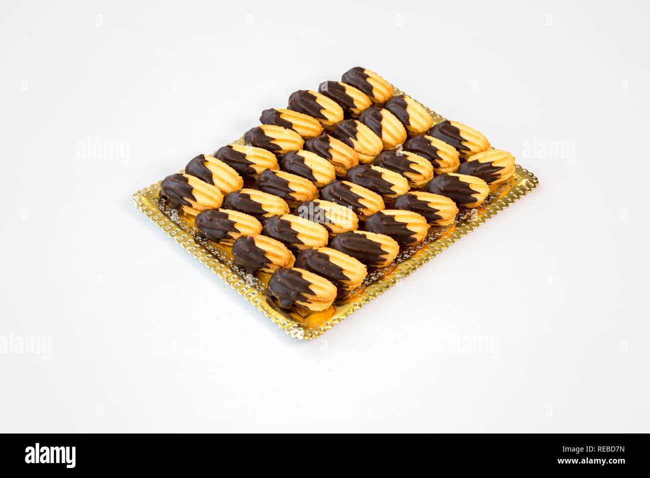 cookies on a gold tray with white background Stock Photo - Alamy
