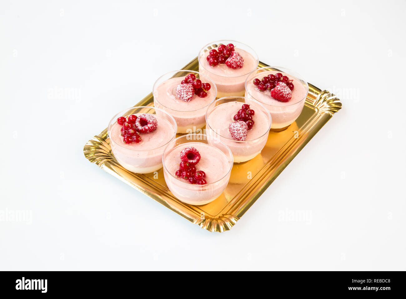 small yogurt fruit cake on a glass with a white background Stock Photo ...