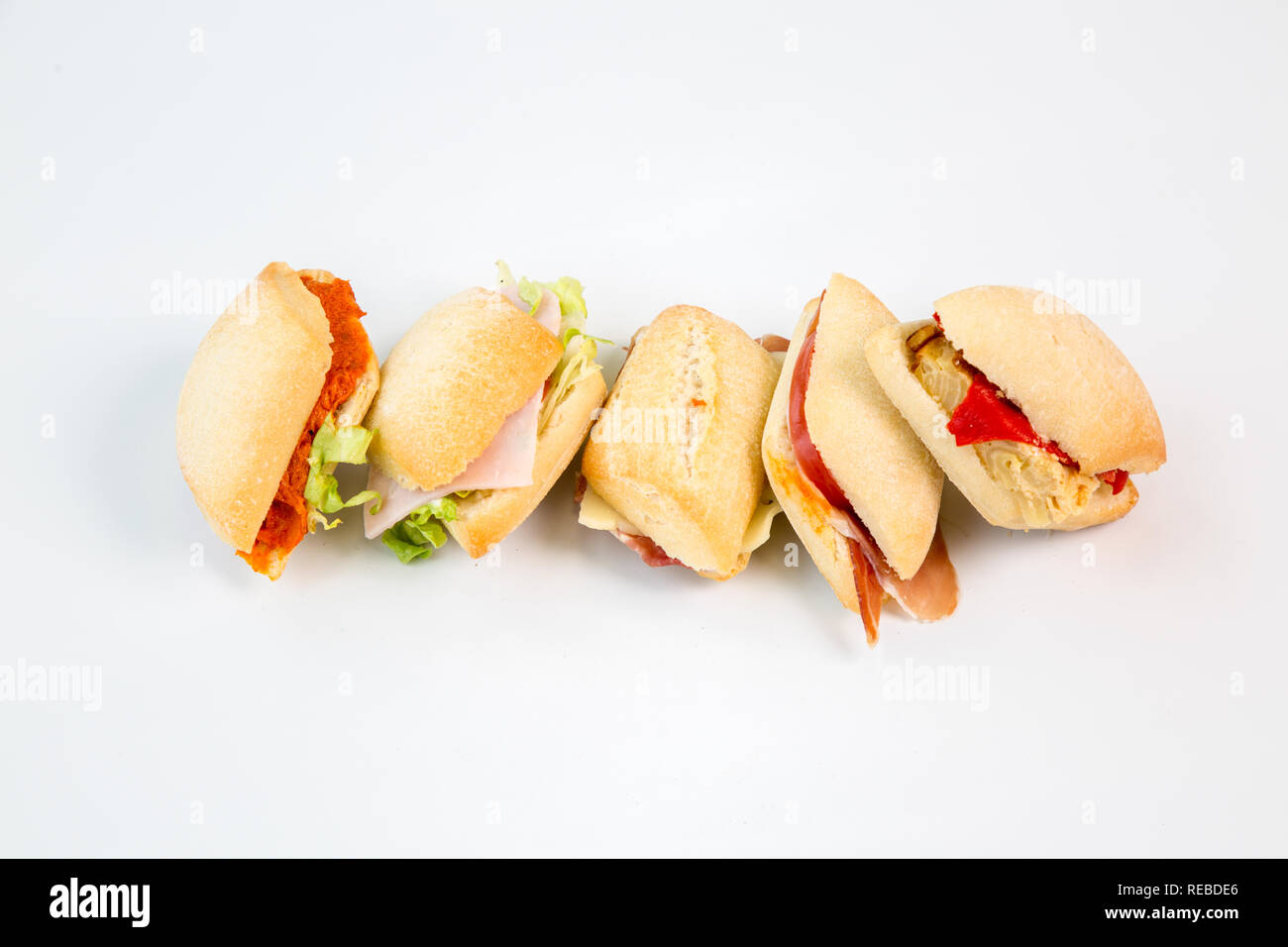 small sandwiches on white background Stock Photo - Alamy