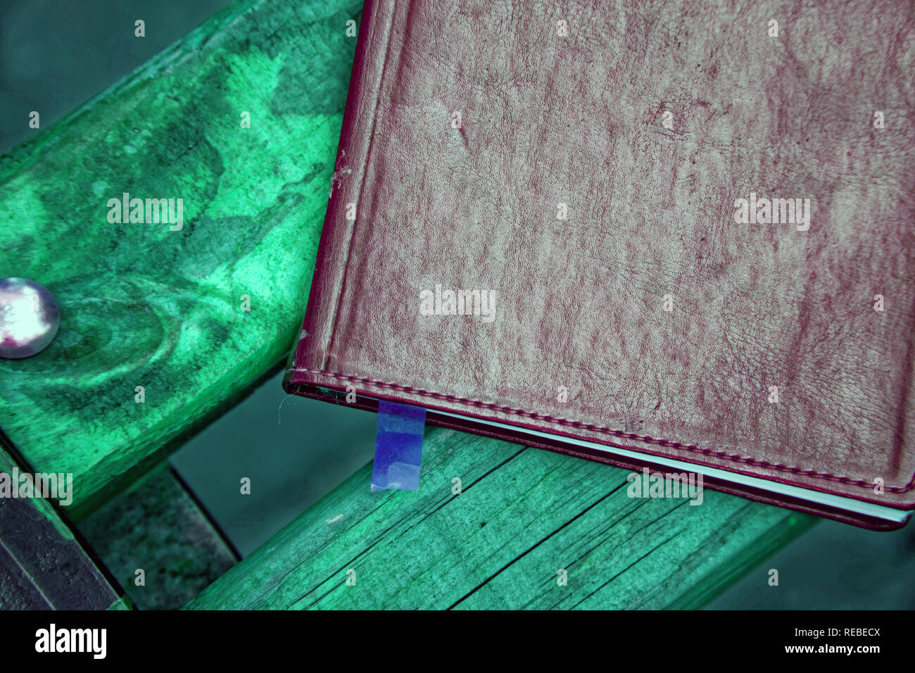 Notebook on bench in park, business concept Stock Photo - Alamy