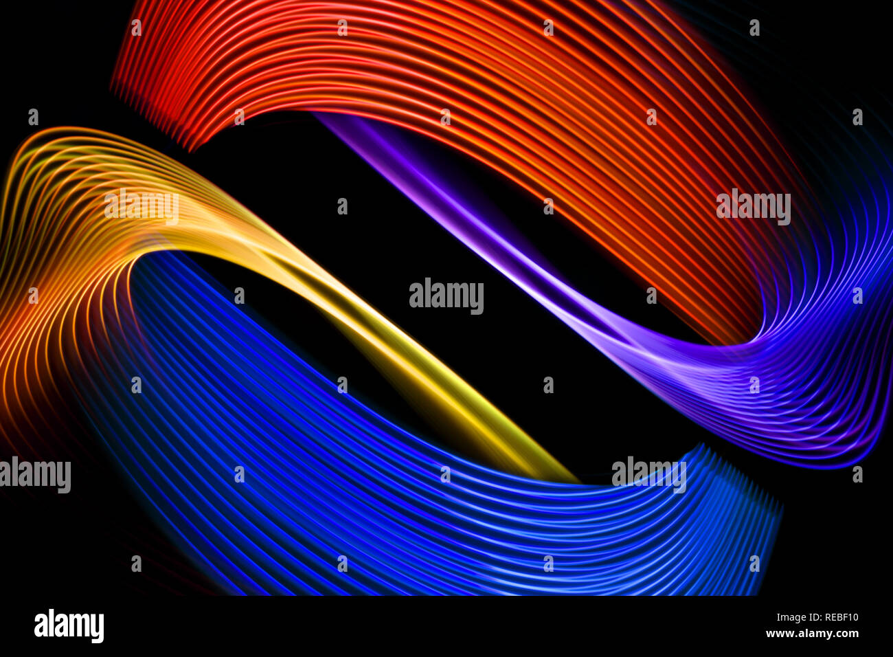 Colorful pink, yellow, orange and blue neon spiral lines.Abstract background of blue neon ...