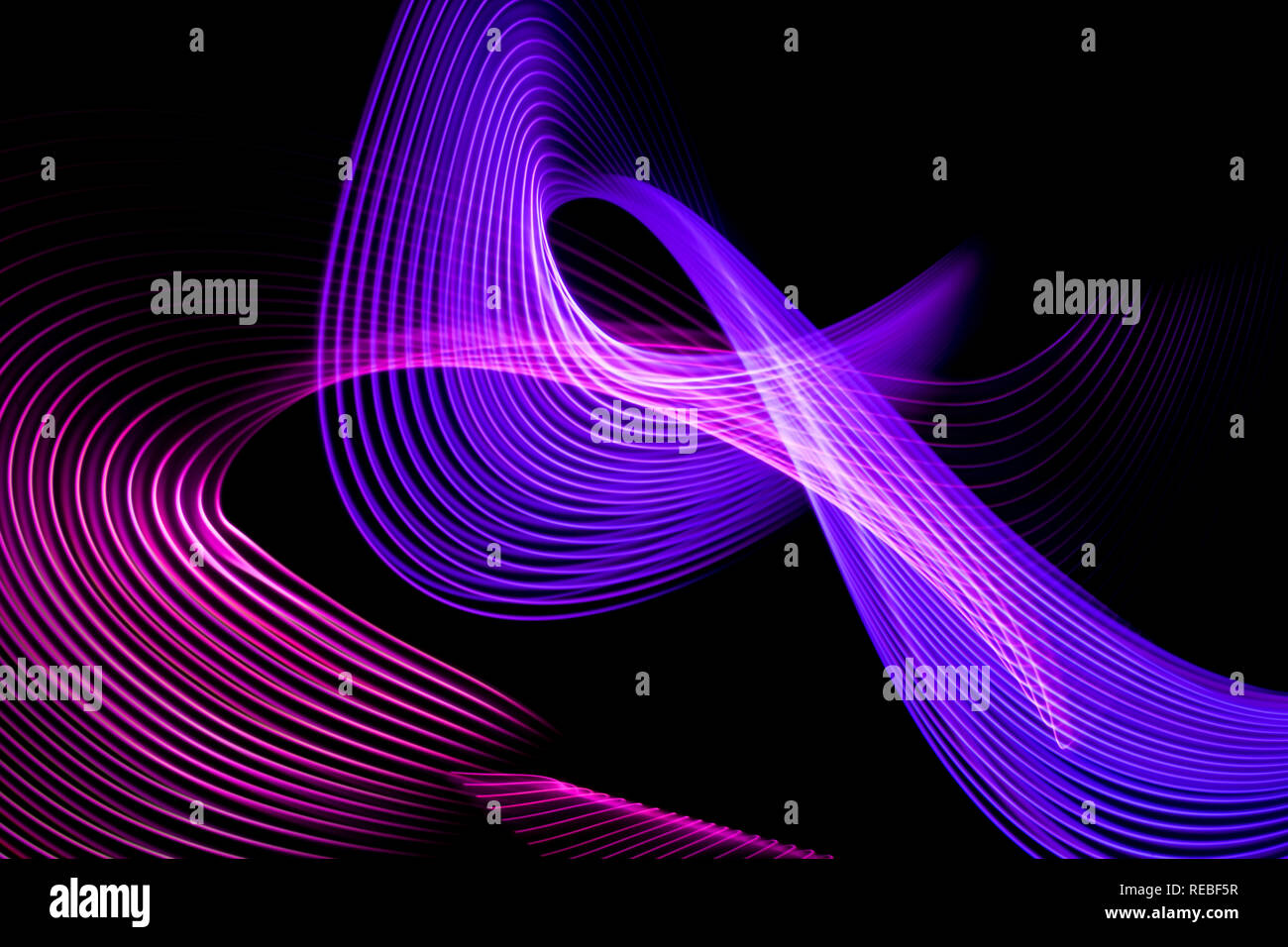 Abstract rainbow neon glowing crossing lines pattern. Dark background of colorful neon blue ...