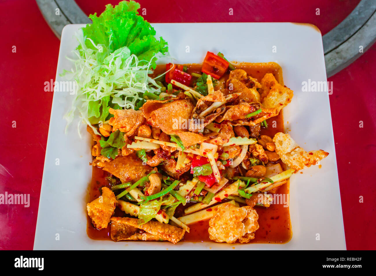 Crispy fish maw in spicy salad, thai food Stock Photo - Alamy