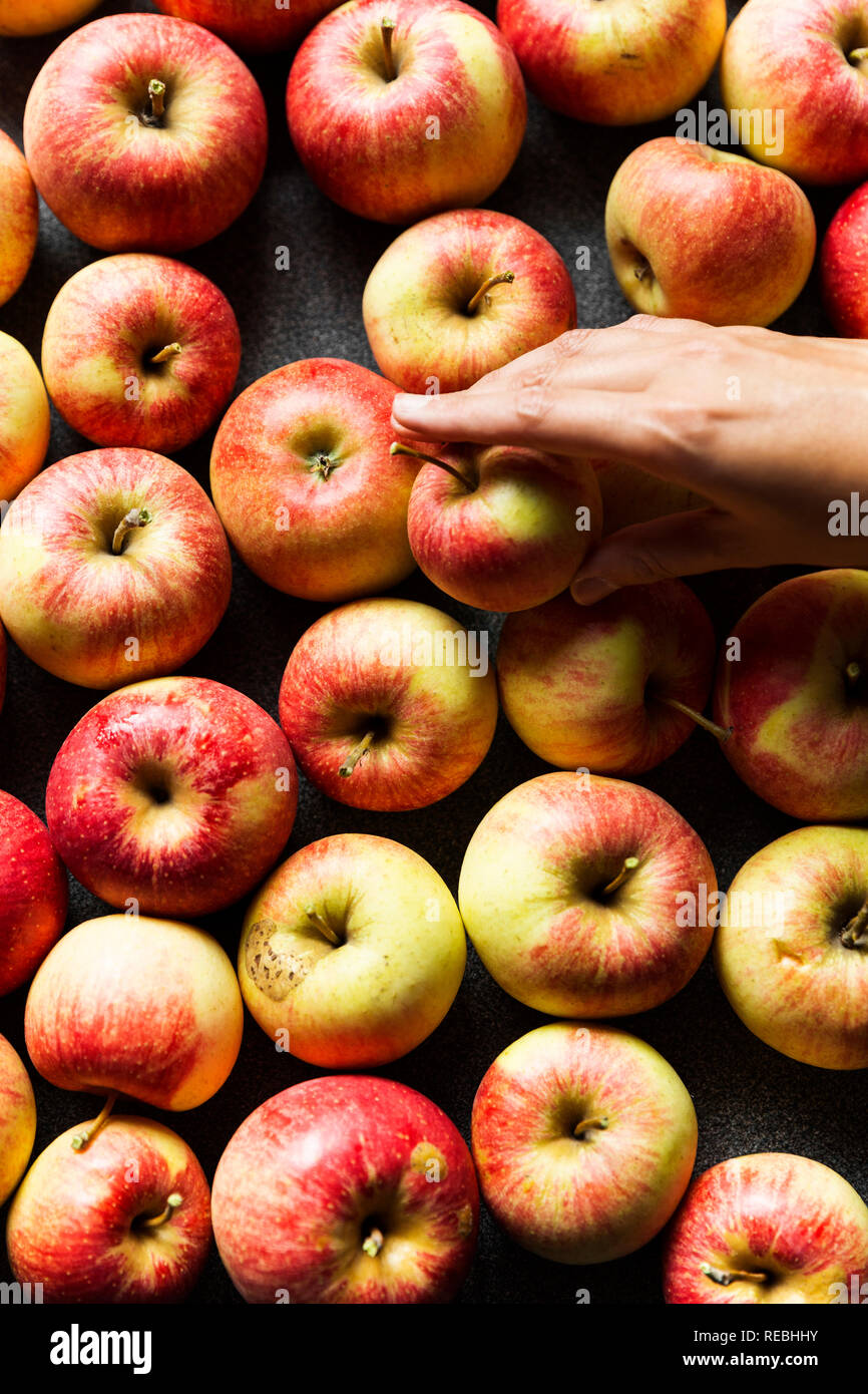 Grabbing an apple hi-res stock photography and images - Alamy
