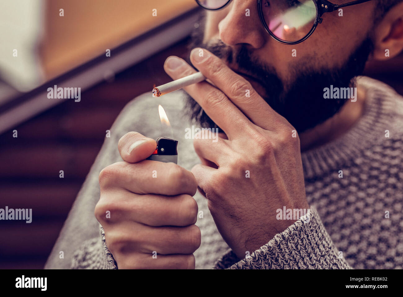 Close up of a lighter being in use Stock Photo - Alamy