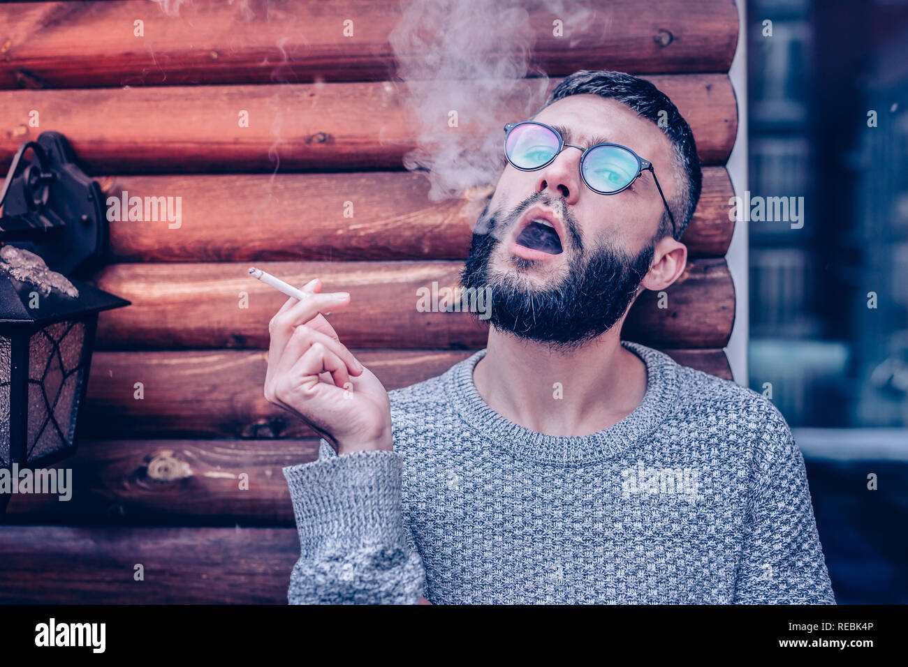 Person Smoking Cigarette Outside House High Resolution Stock ...
