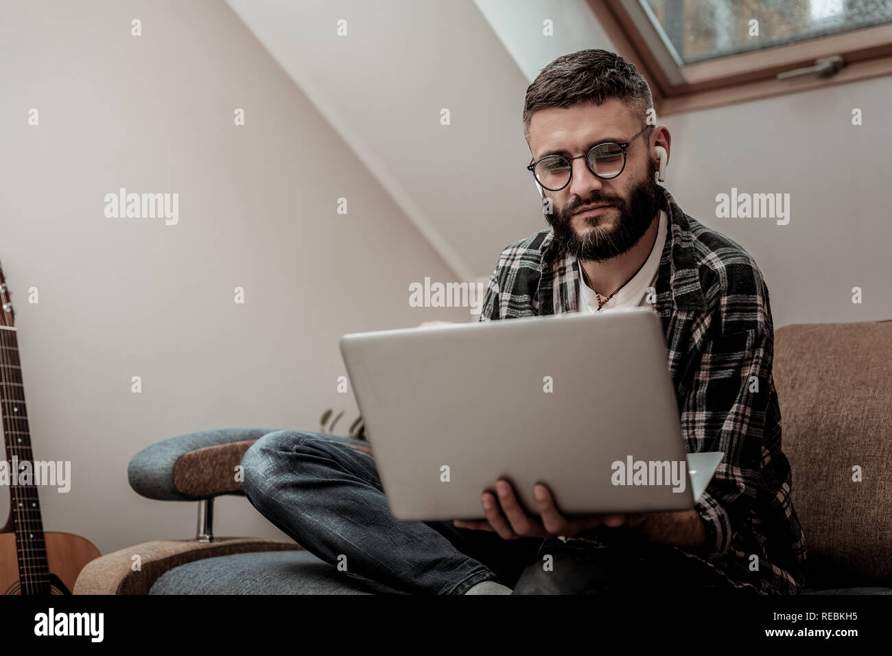 Smart young man working on the laptop Stock Photo - Alamy