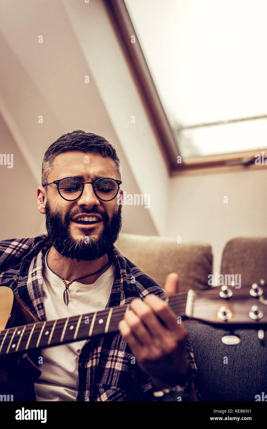 Handsome talented man singing his own song Stock Photo - Alamy