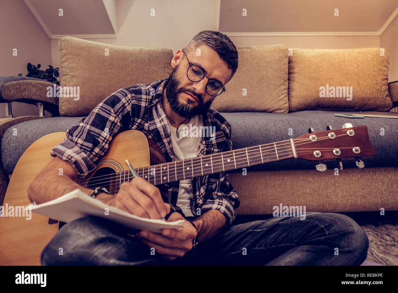 Serious concentrated man taking notes on paper Stock Photo - Alamy