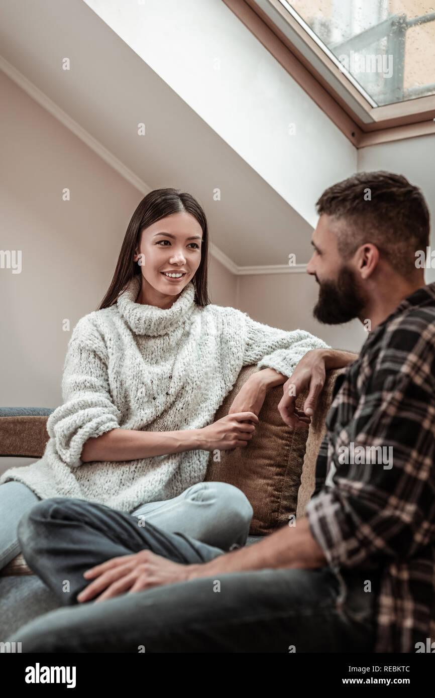 Positive nice young couple having a conversation Stock Photo - Alamy