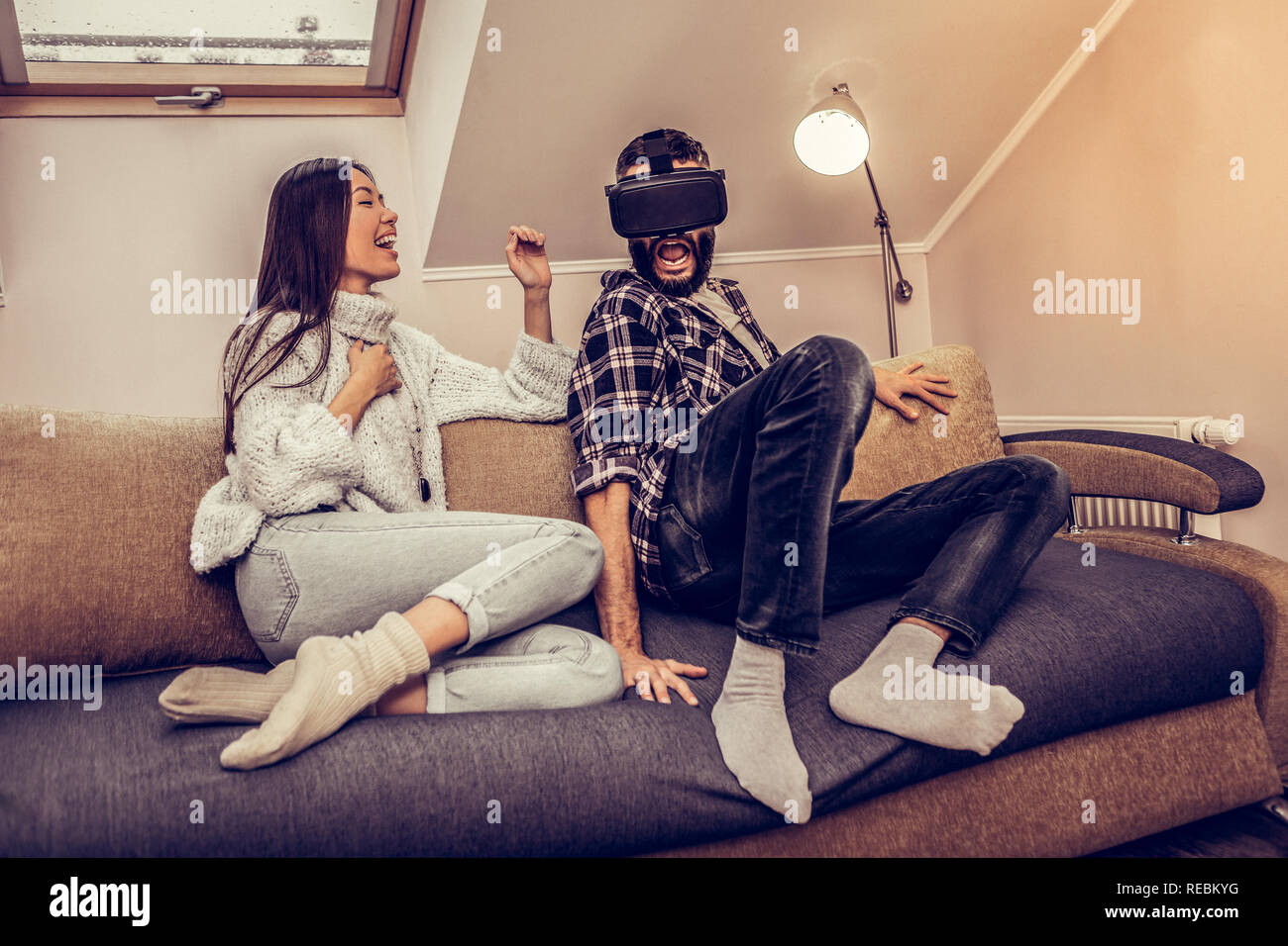Nice young woman laughing at her boyfriend Stock Photo - Alamy