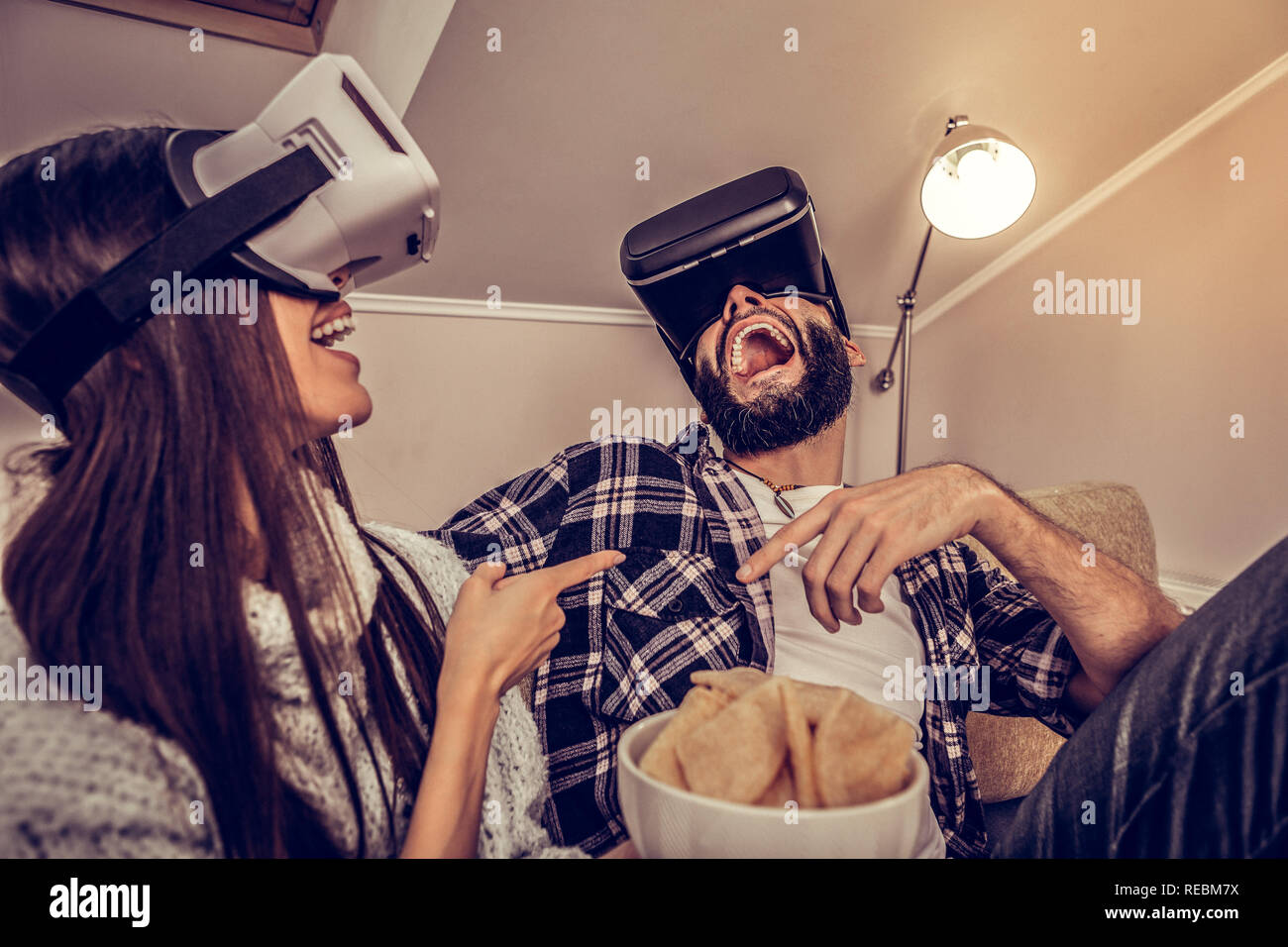 Happy delighted couple enjoying their time at home Stock Photo - Alamy